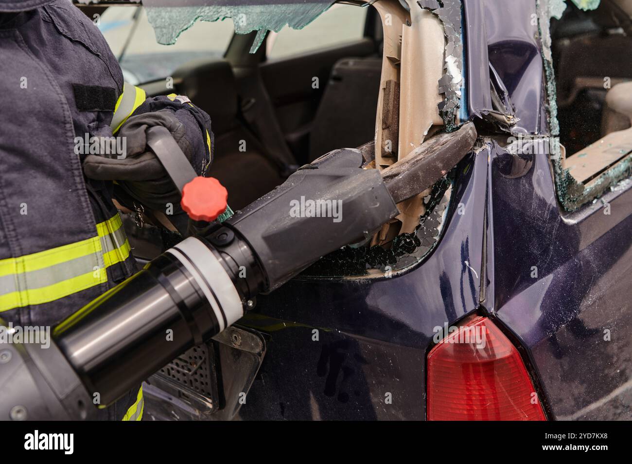 A dedicated team of professional firefighters employs specialized tools ...