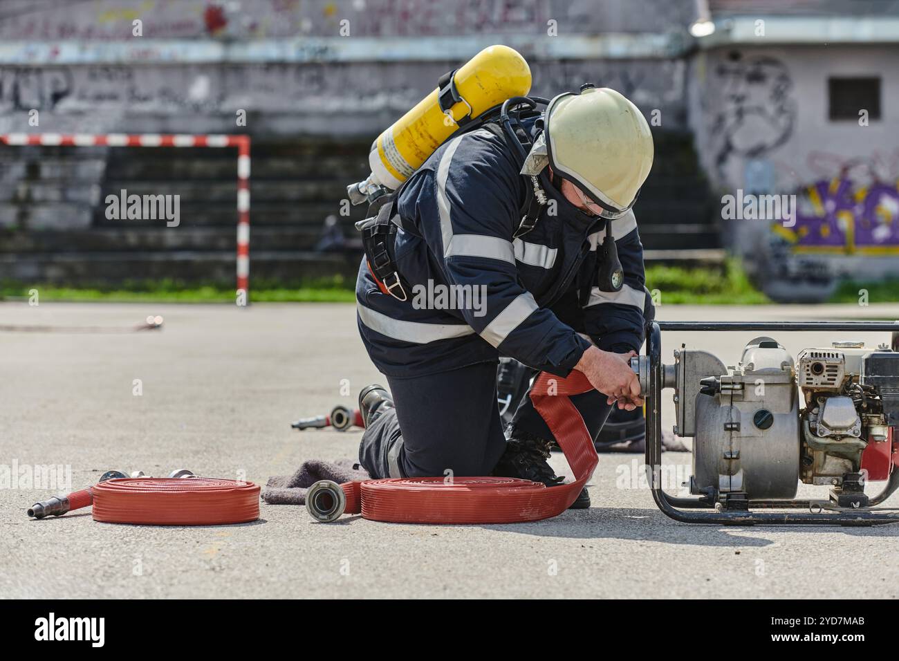 A firefighter dons the essential components of their professional gear ...