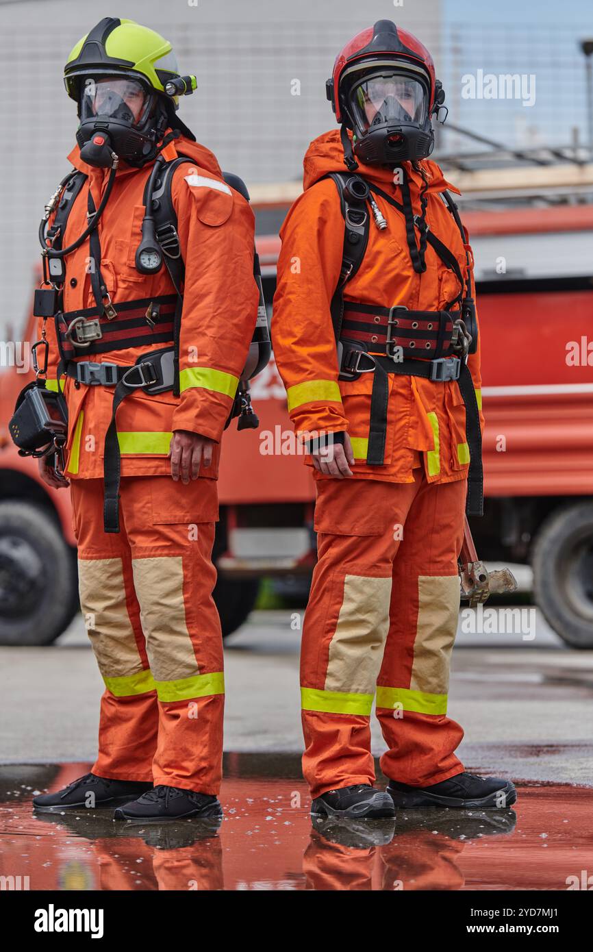 A team of firefighters, dressed in professional gear, undergoes ...
