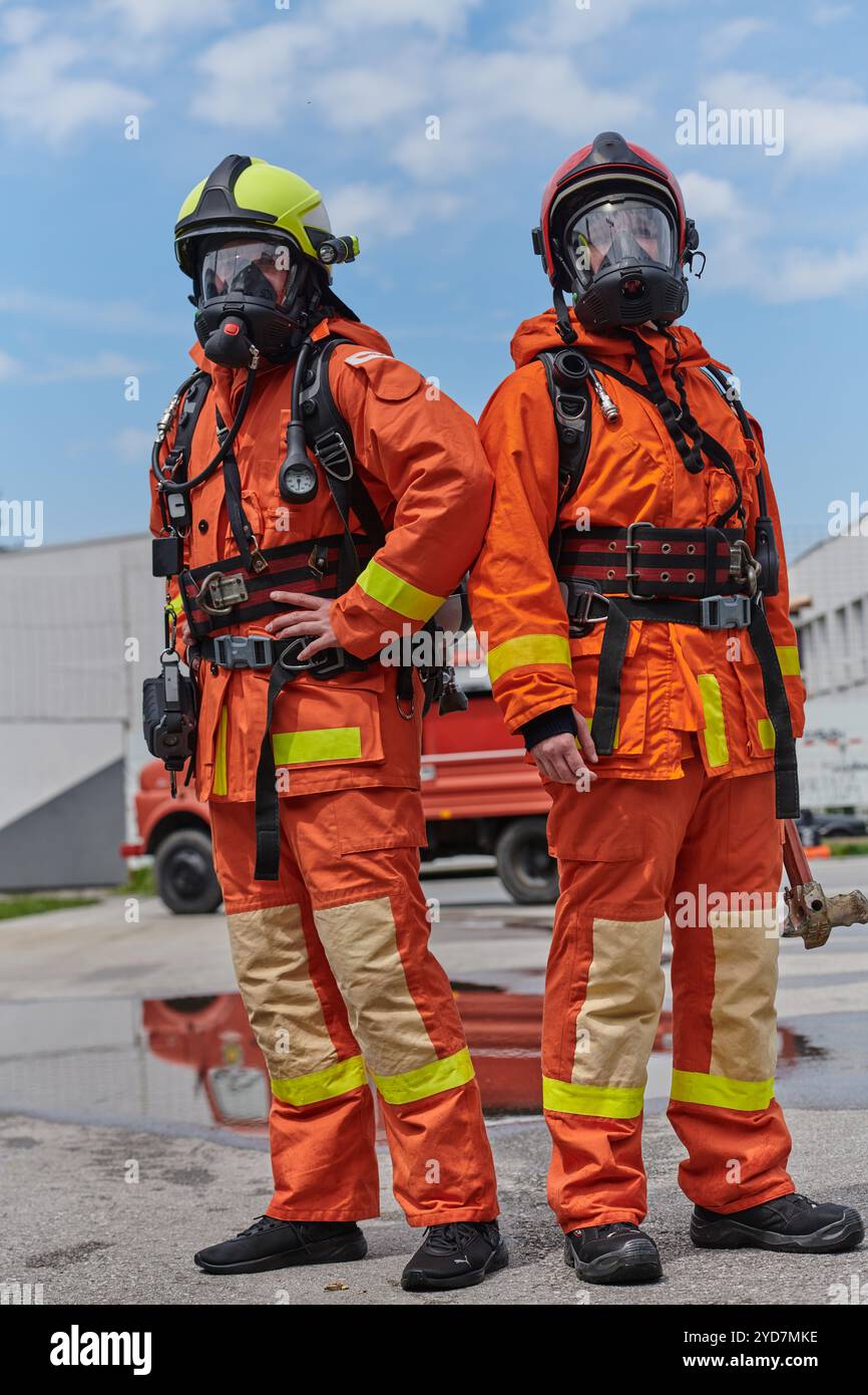 Firefighter Team Training with Various Tools in Professional Gear Stock ...
