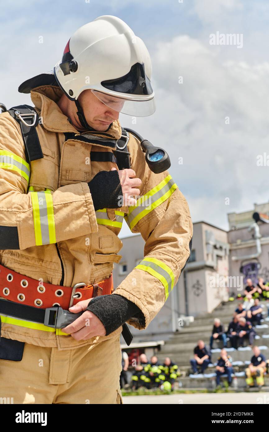A firefighter dons the essential components of their professional gear ...