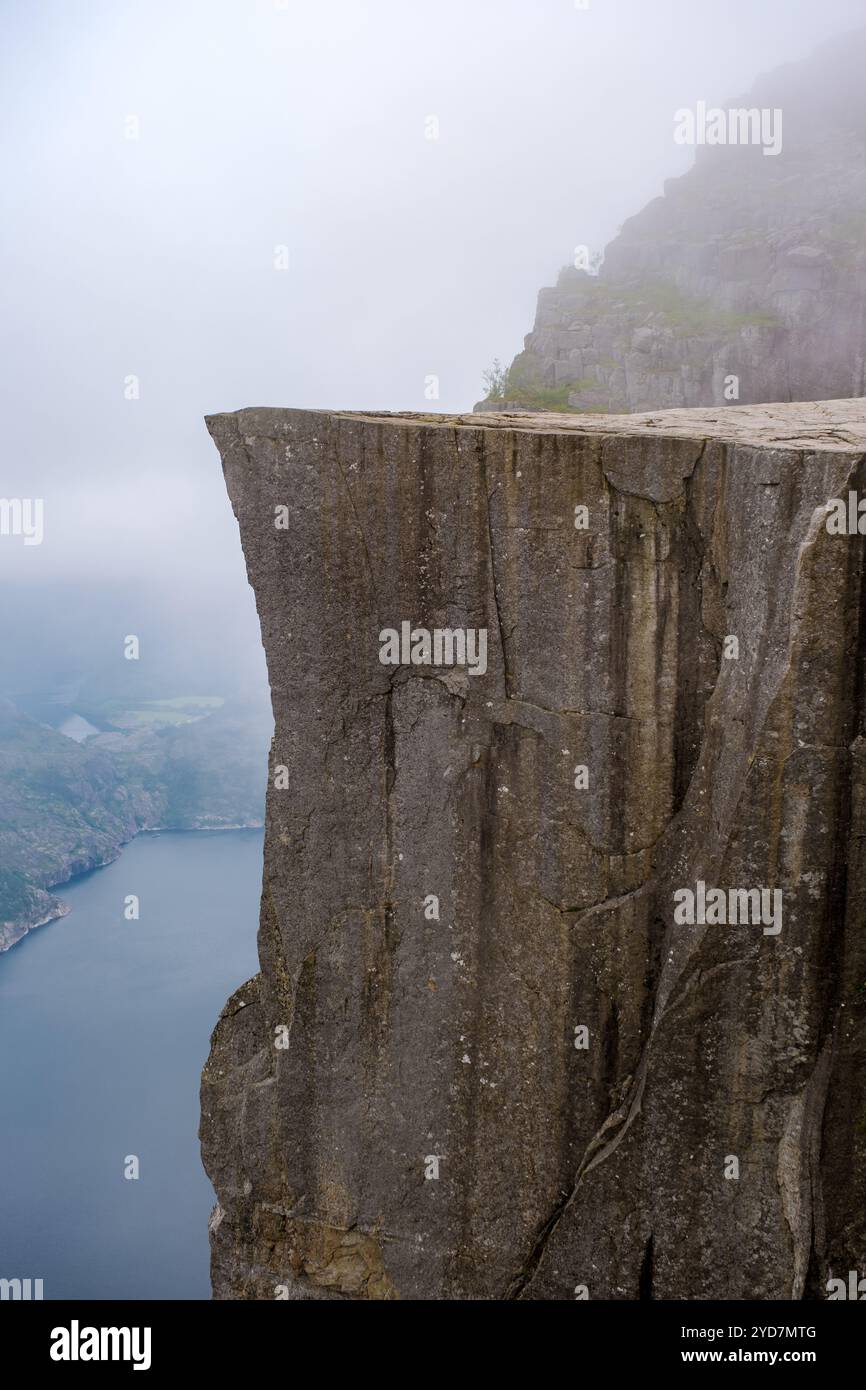 A breathtaking view from the edge of Preikestolen, a cliff in Norway ...
