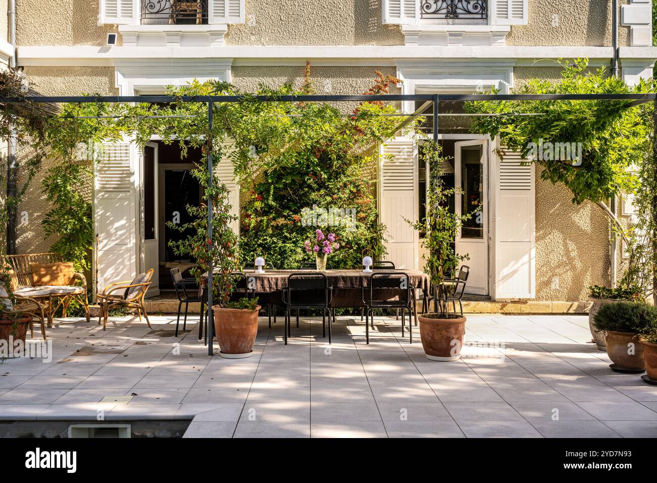 Terrace dining and pergola outside luxury villa in South of France ...