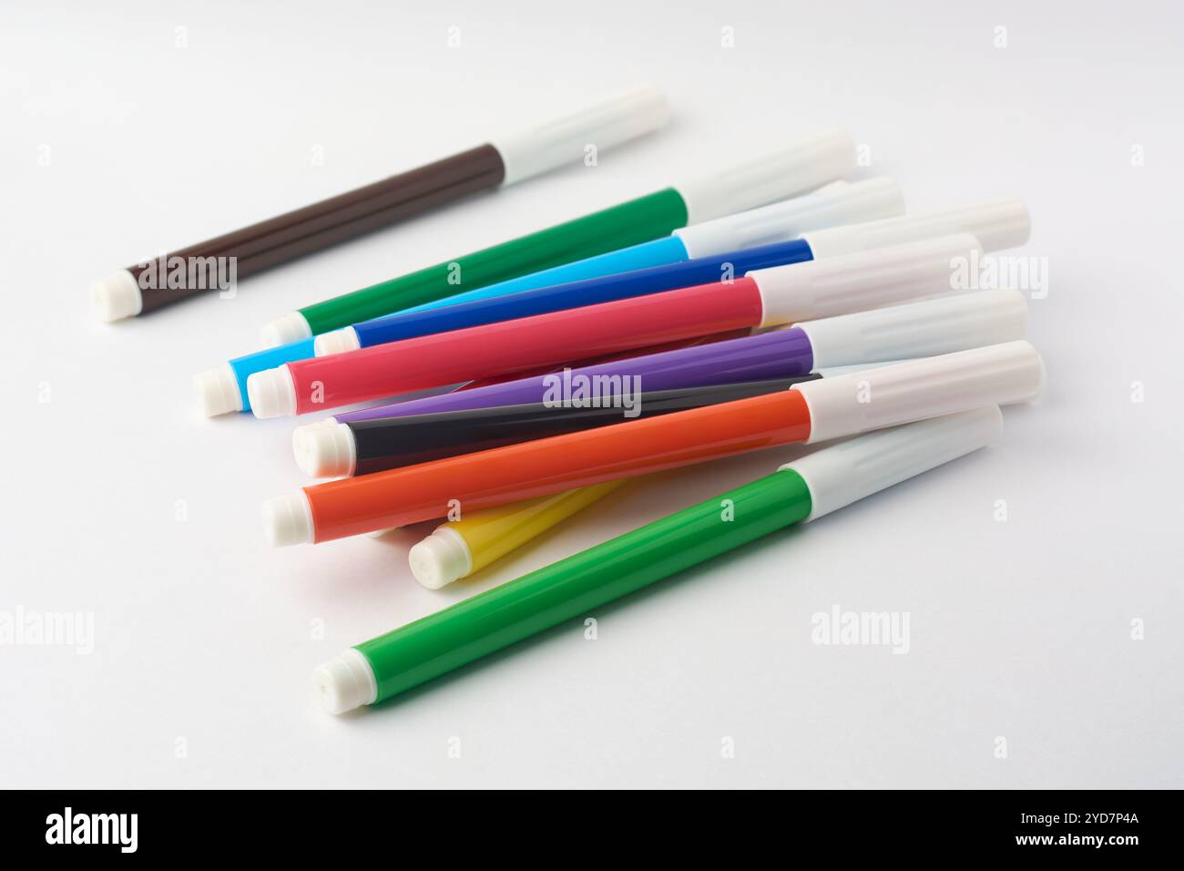 colorful felt tip or fiber tip pens scattered isolated white background ...