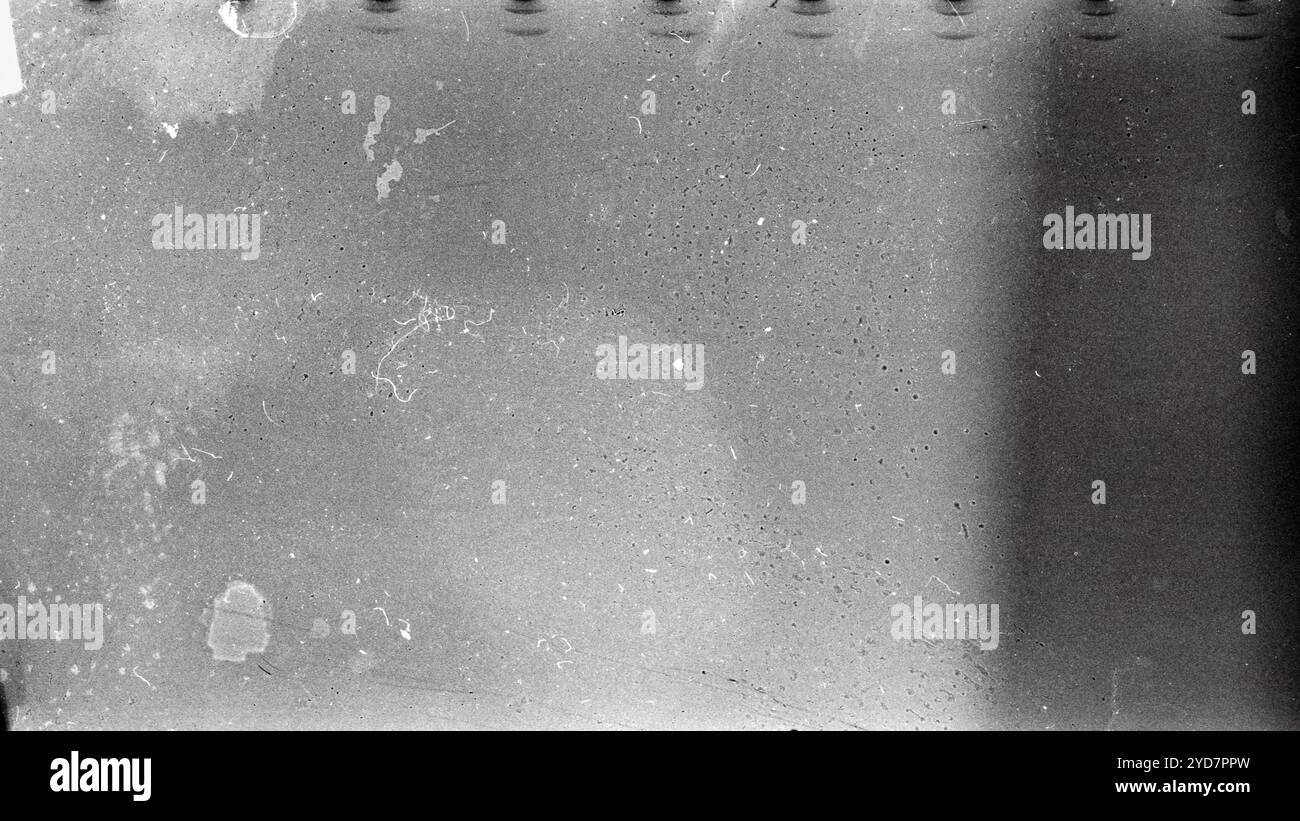 Blank grained film strip texture background with heavy grain, dust and ...
