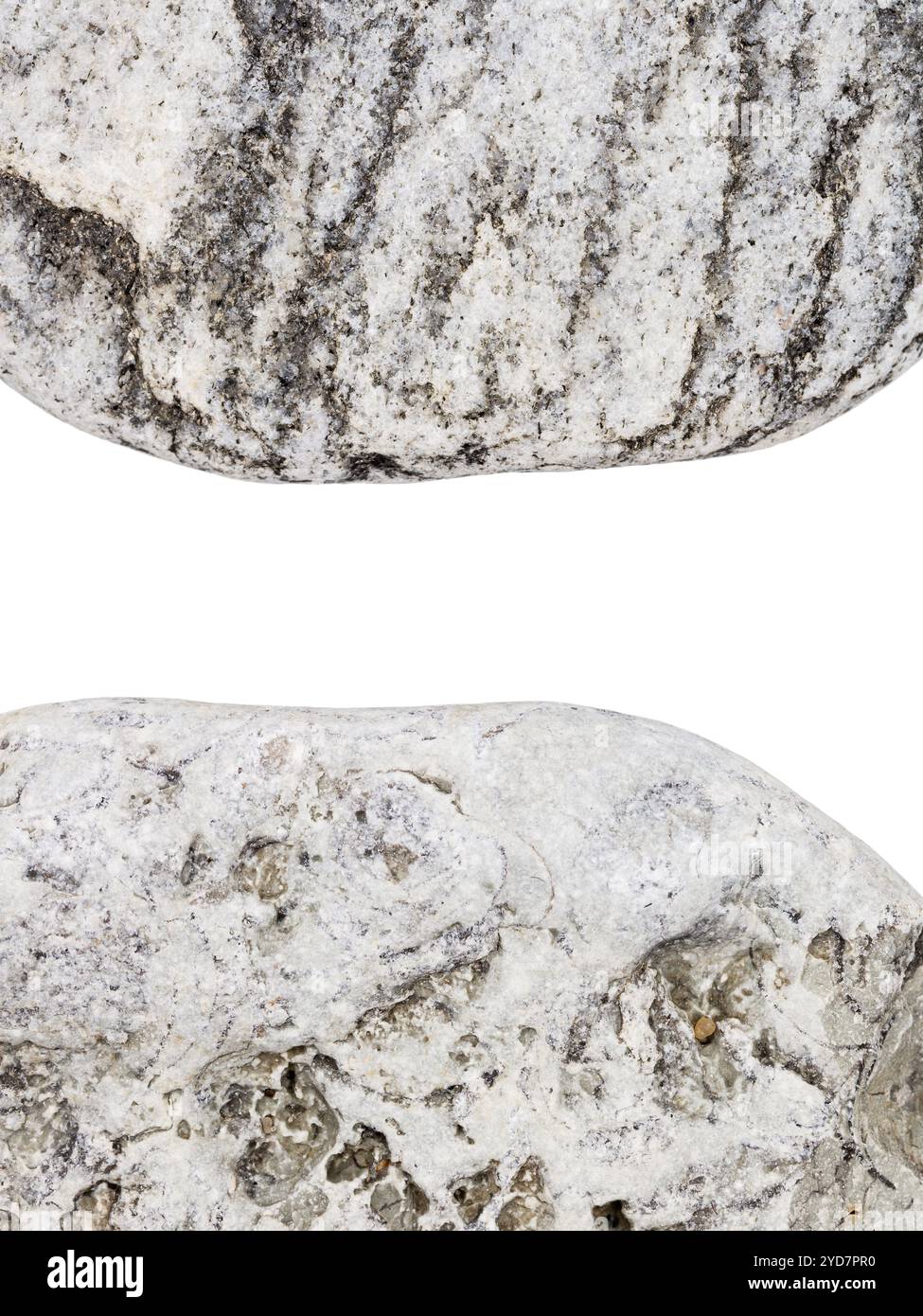 Edges of two pebbles isolated on white background with a space for text ...