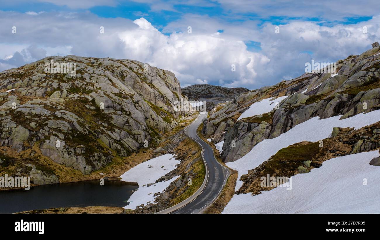 A scenic road twists through a breathtaking Norwegian mountain pass ...
