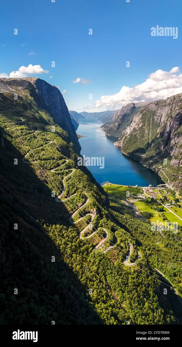 A scenic view of a winding road snaking through the green mountains of ...