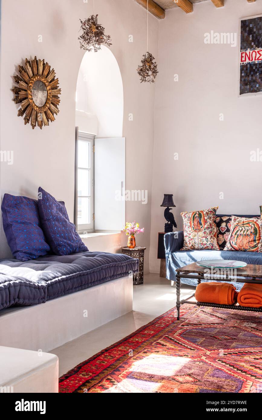 Arched window and seating area in renovated historic house on the ...