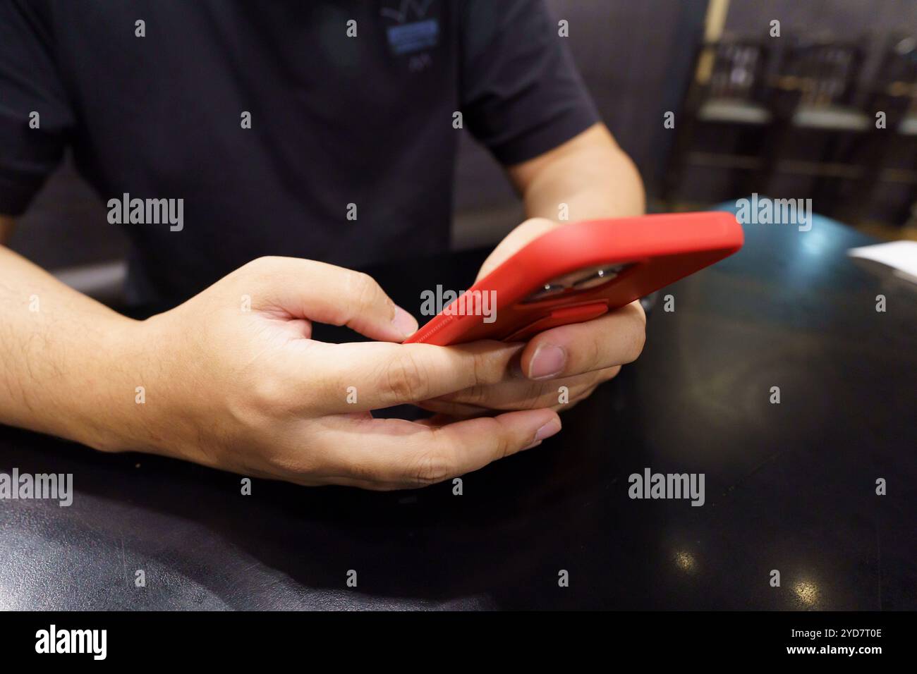 Man playing game on mobile phone. gamer boy playing video games holding ...
