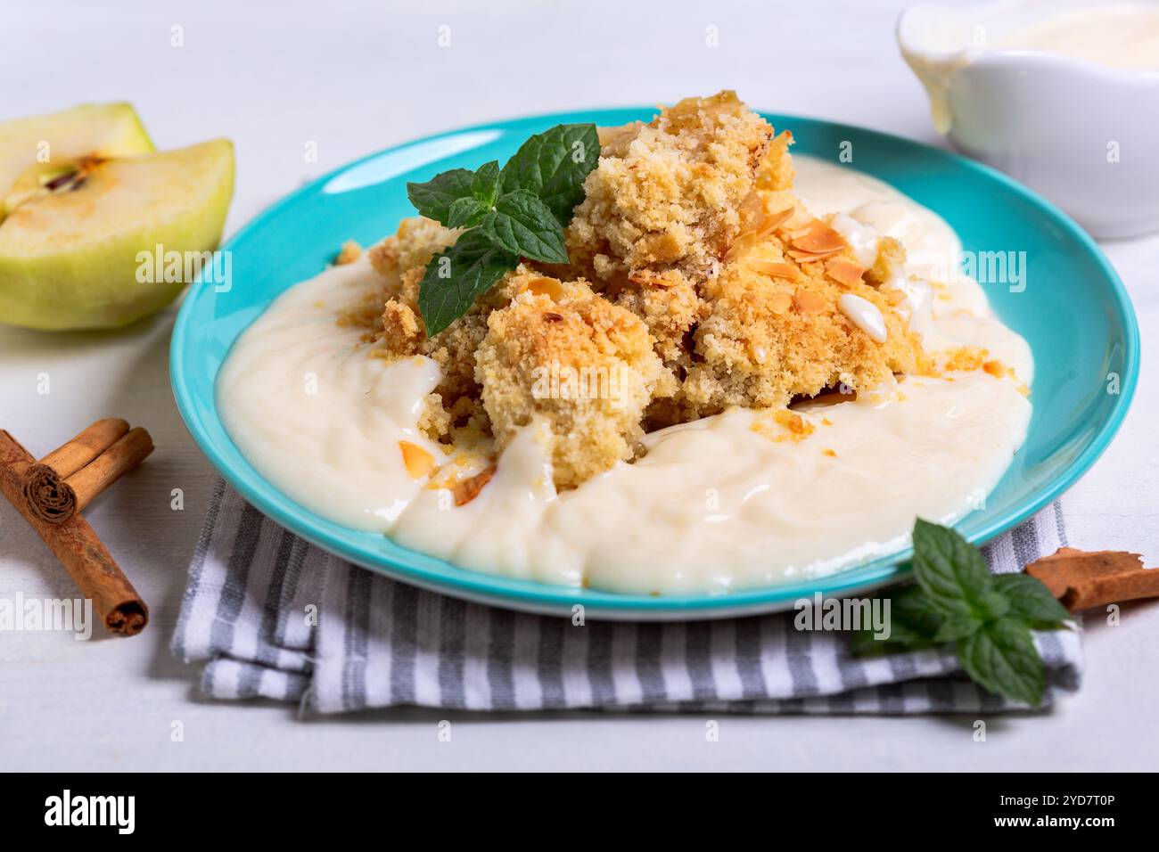Apple crumble with custard Stock Photo - Alamy