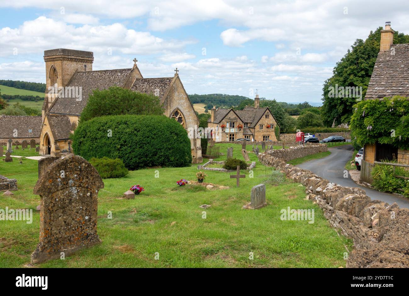 The charming village of Snowshill church and village pub nestled in the ...