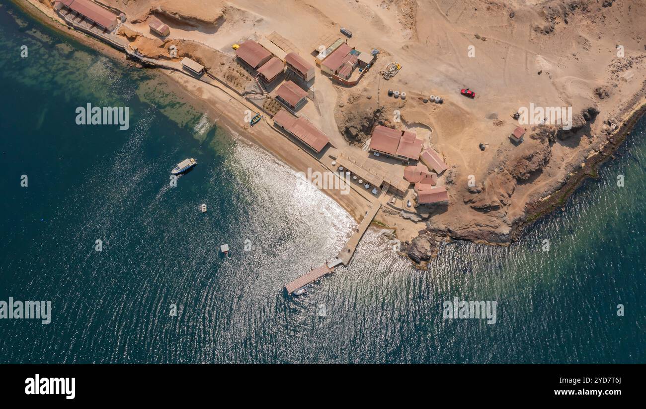 A beach with a small town on the shore, Paracas national park, Peru ...