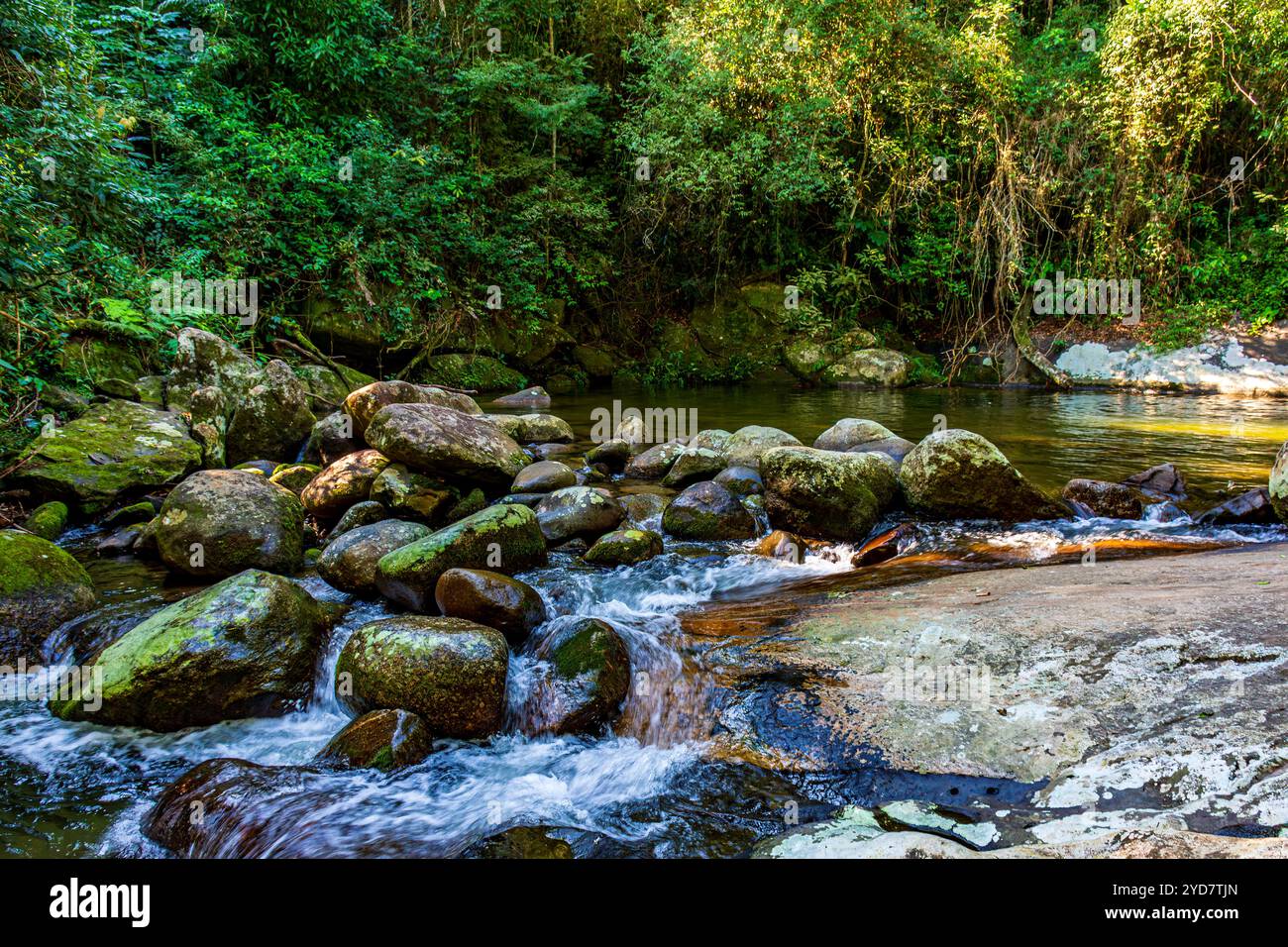 Waterfall between rocks in the rainforest Stock Photo - Alamy