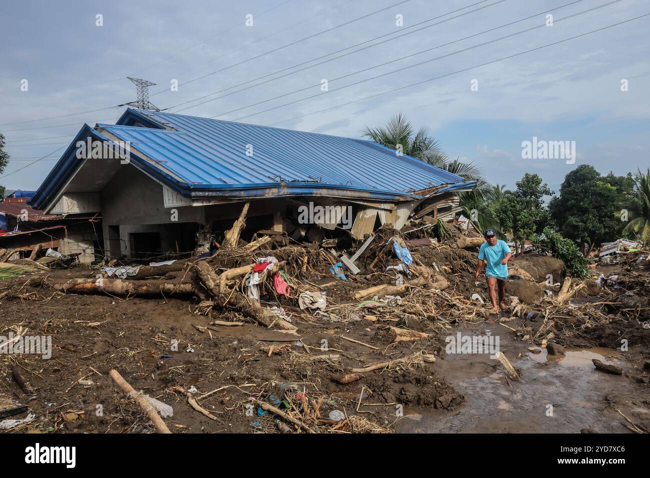 Batangas Province, Philippines. 25th Oct, 2024. A house is buried in ...
