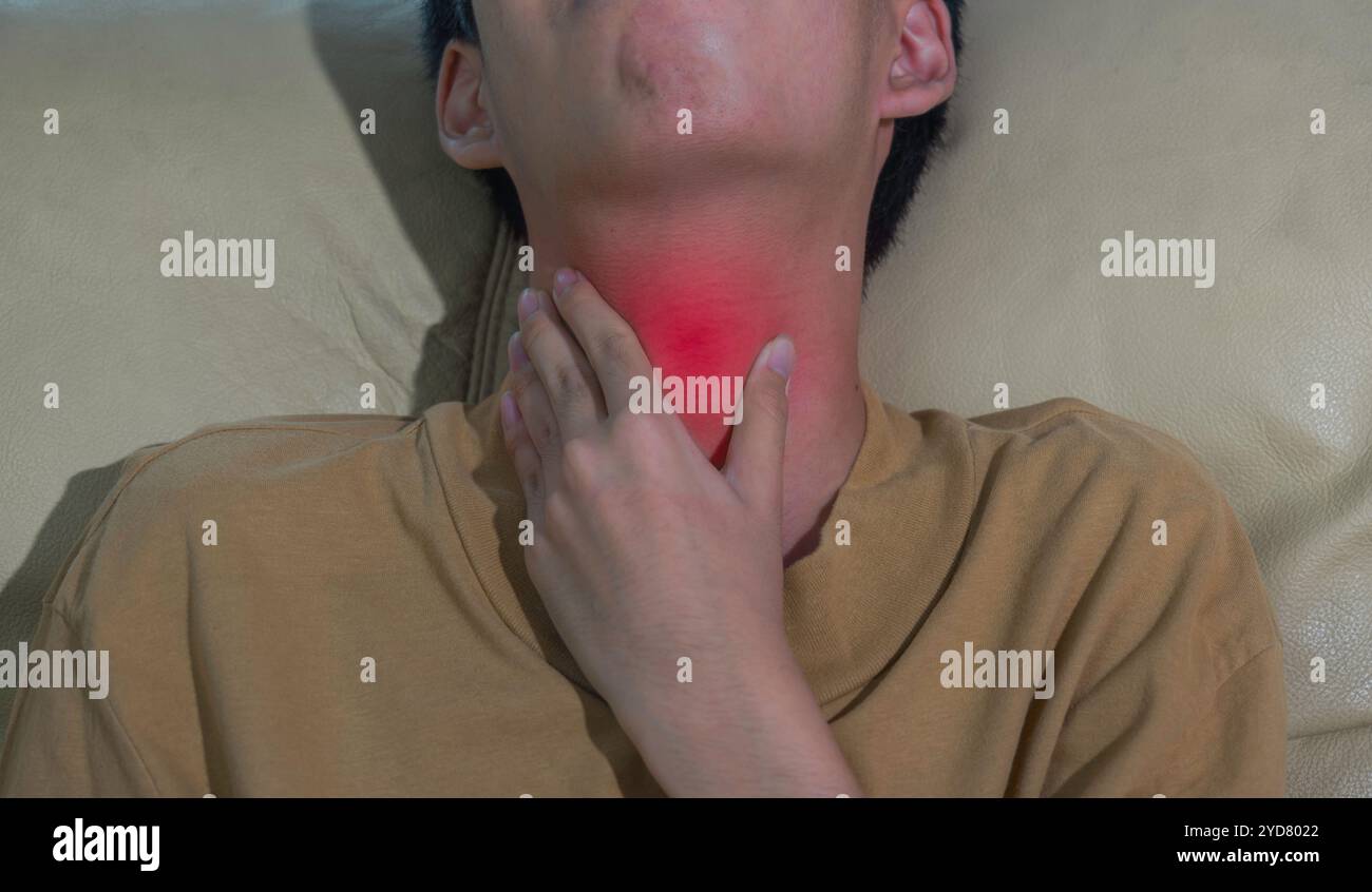 Close up ill young man touching sore throat feeling or dehydration with ...