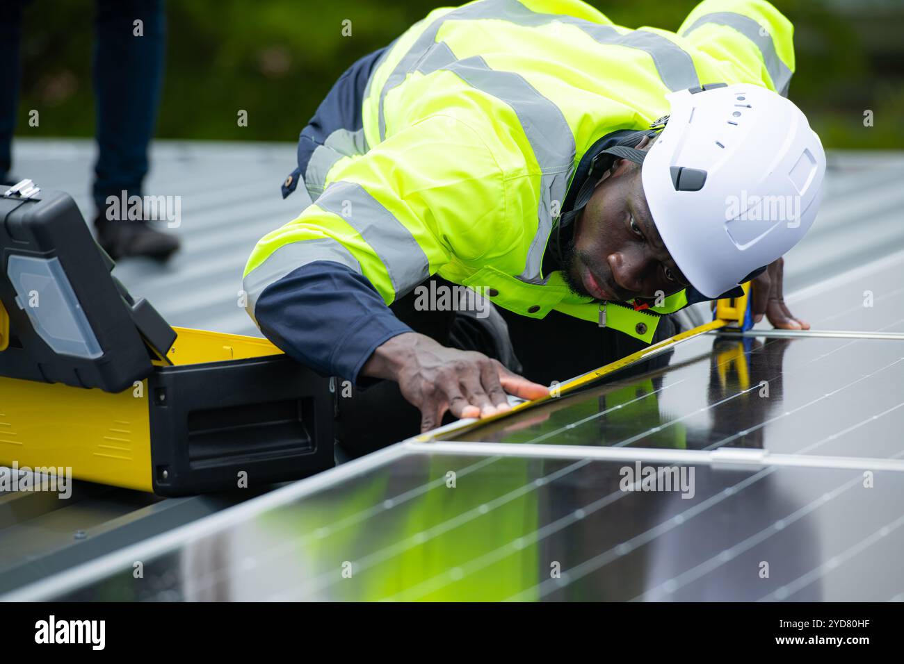 Engineer and technician inspects solar panel installation and test the ...