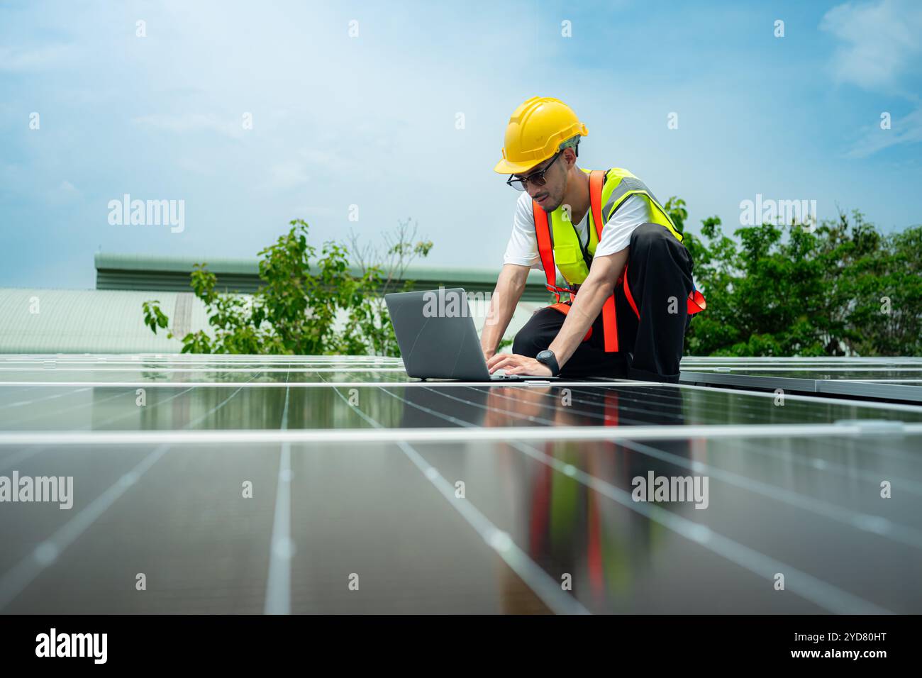Technician inspects solar panel installation and test the operation of ...