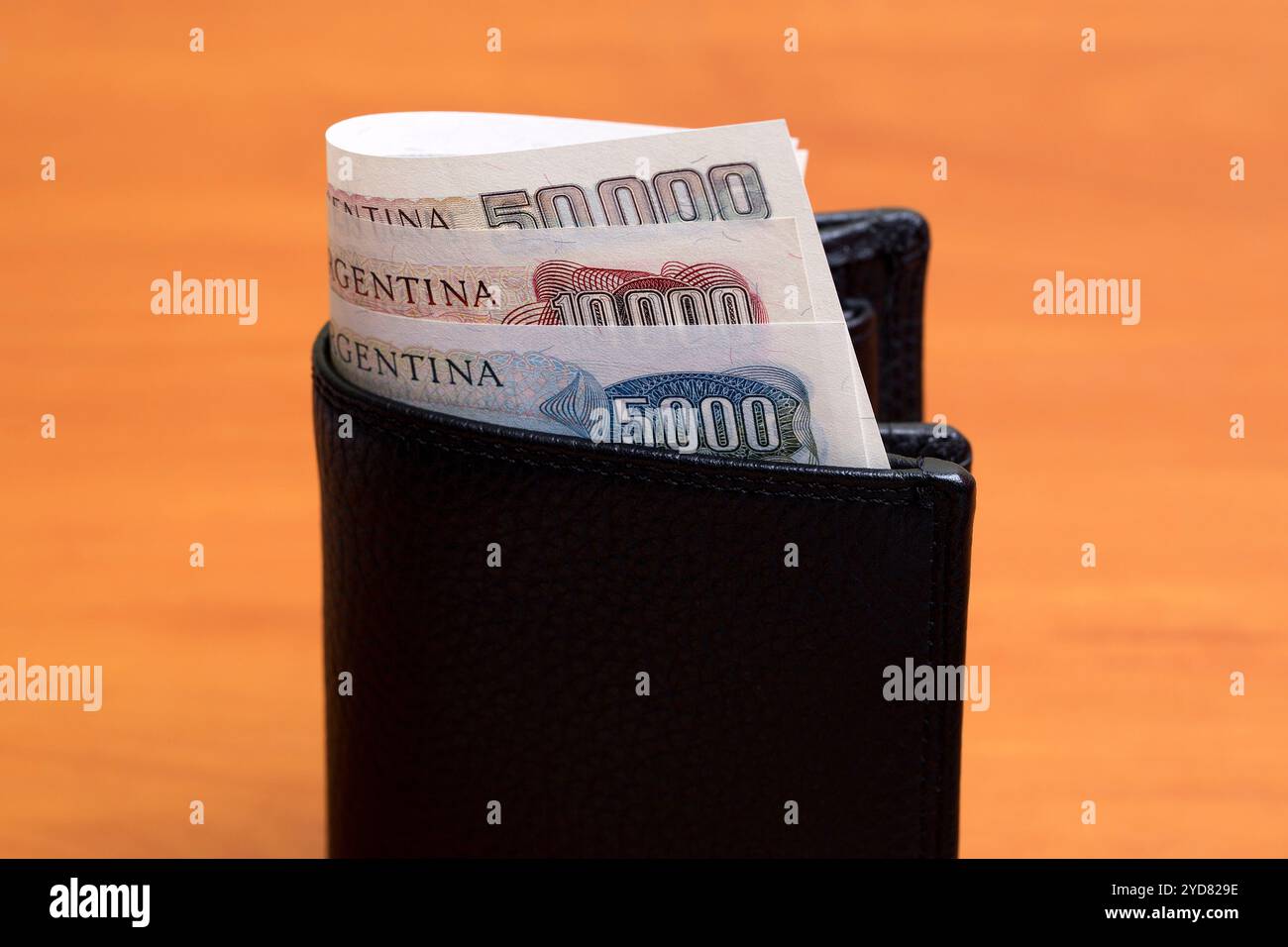 Old Argentine peso in the black wallet Stock Photo - Alamy