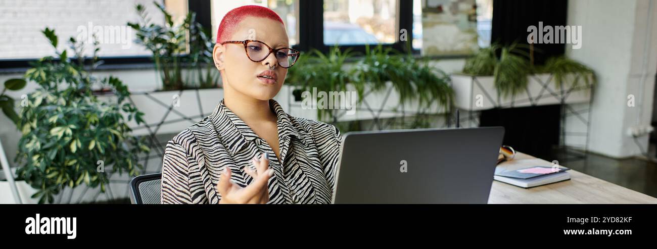 A bald woman with vibrant hair color shares ideas in a stylish work ...