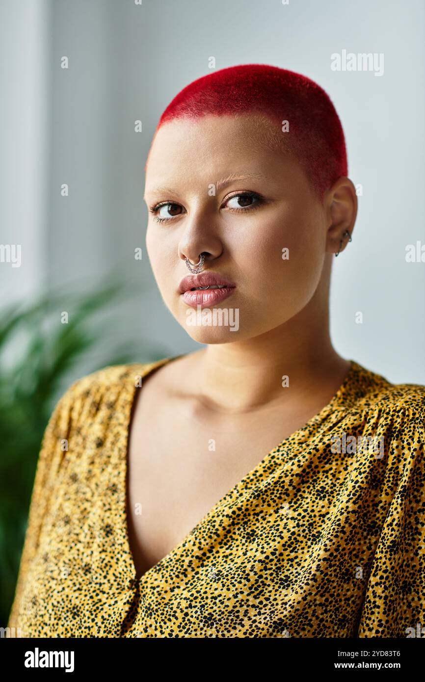 A bald woman with red hair wears a stylish outfit while showcasing her ...
