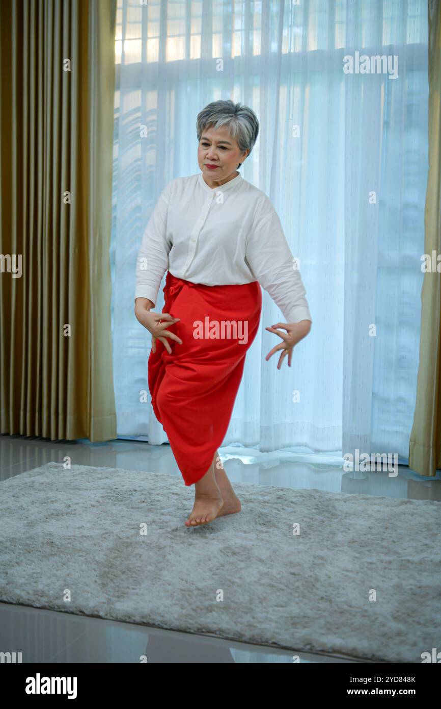 Elderly women relax by practicing traditional Thai dance Stock Photo ...