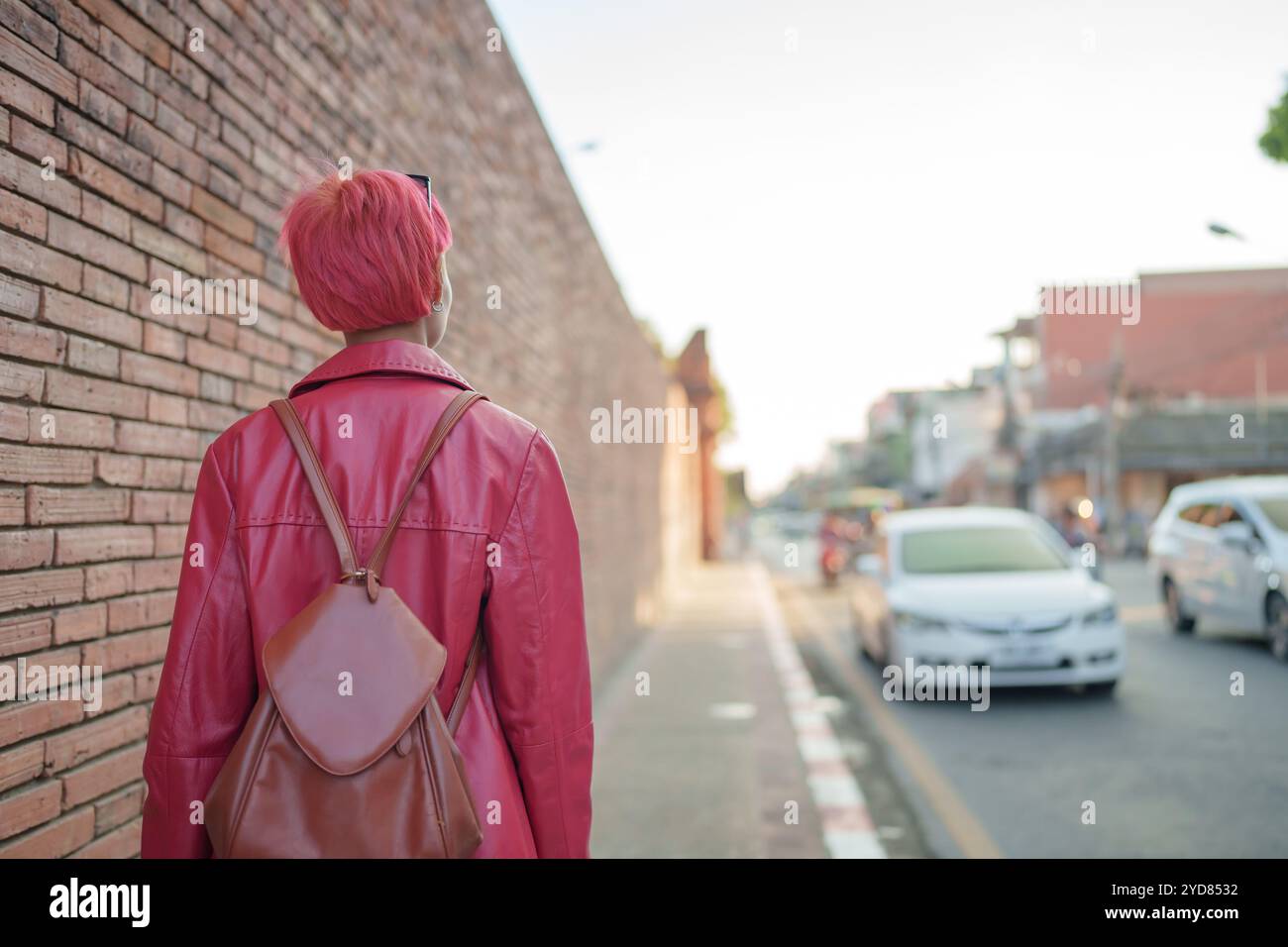 Gen z girl leather fashion with punk Asian woman tourist of local city ...