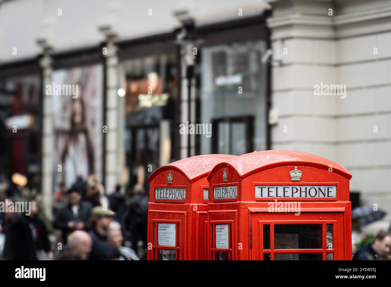 Iconic red telephone boxes in busy London street Stock Photo - Alamy