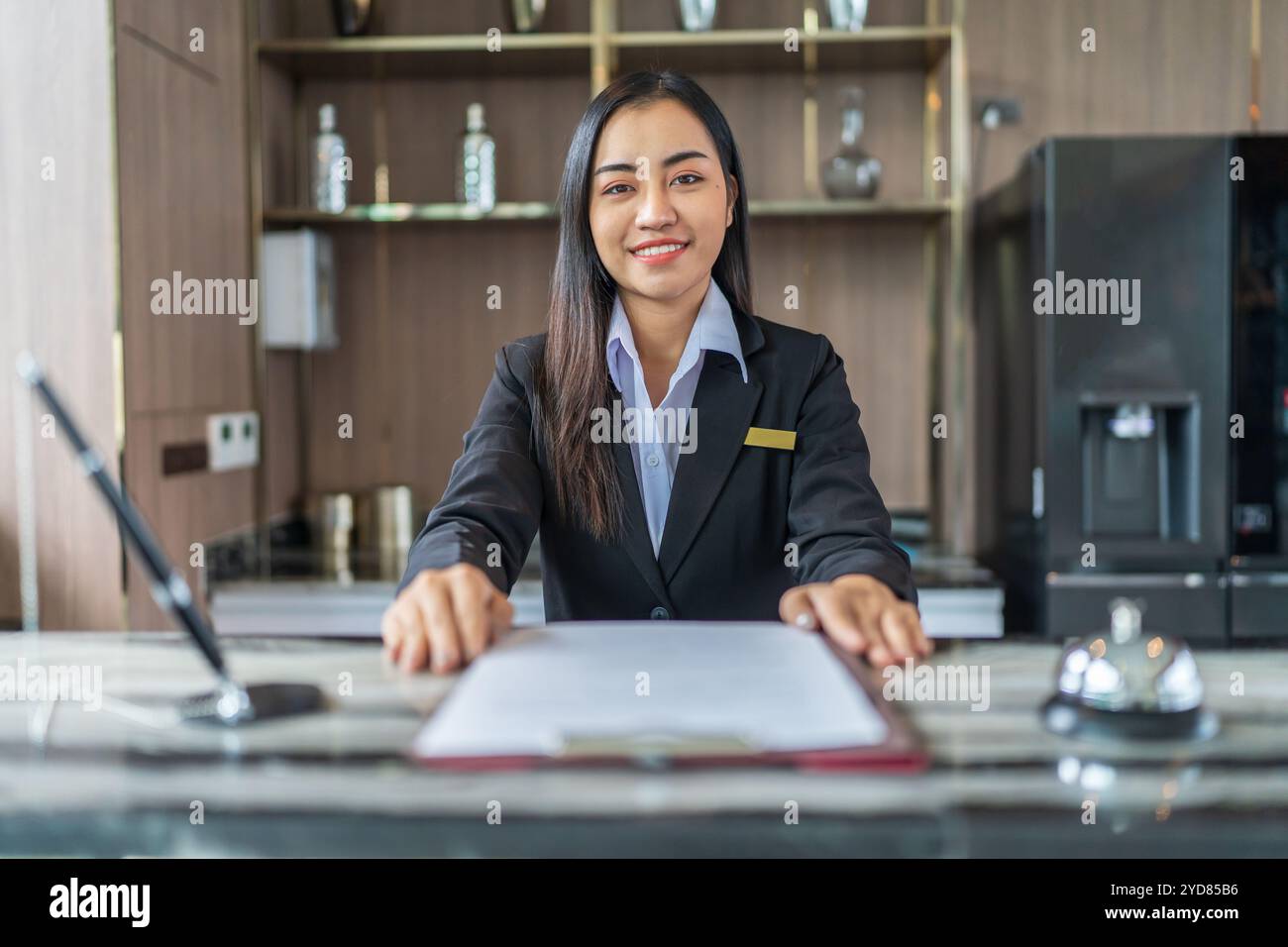 Beautiful asian hotel receptionist in uniforms at desk in lobby ...
