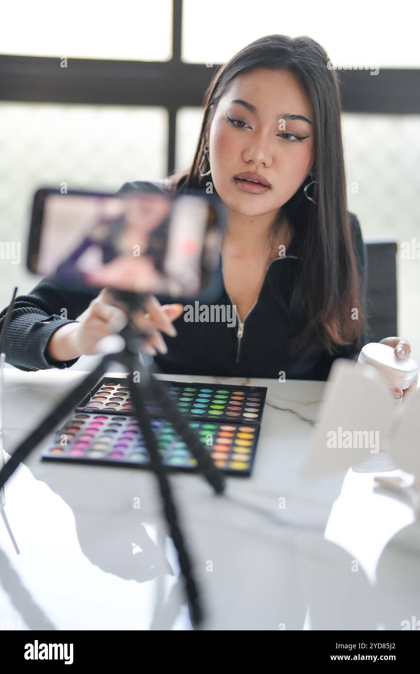 Asian girl makeup artist Professional Woman blogger vlogger is showing ...