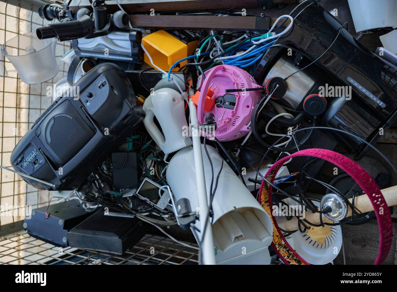 Electronic waste in a pallet cage at the recycling center. Electronic ...