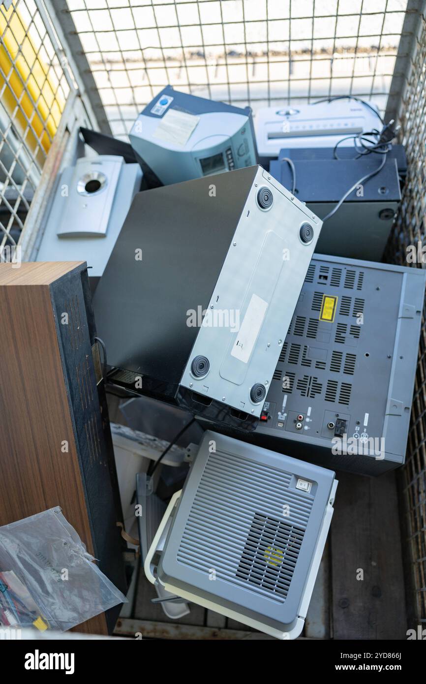 Electronic waste in a pallet cage at the recycling center. Electronic ...