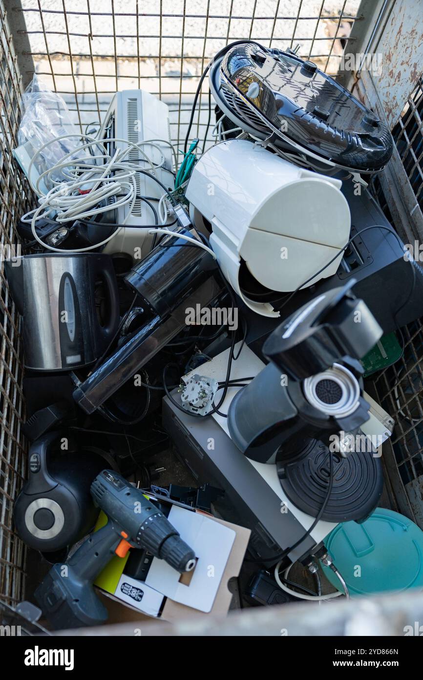 Electronic waste in a pallet cage at the recycling center. Electronic ...