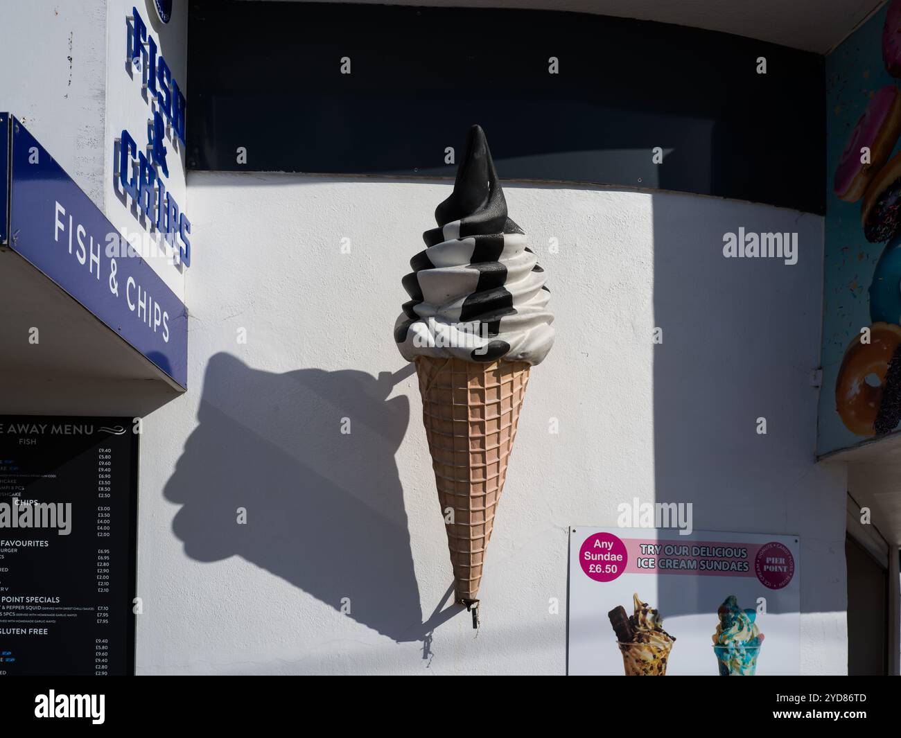LARGE ICE CREAM SIGN WITH DRAMATIC SHADOW TORQUAY TORBAY SEASIDE RESORT ...