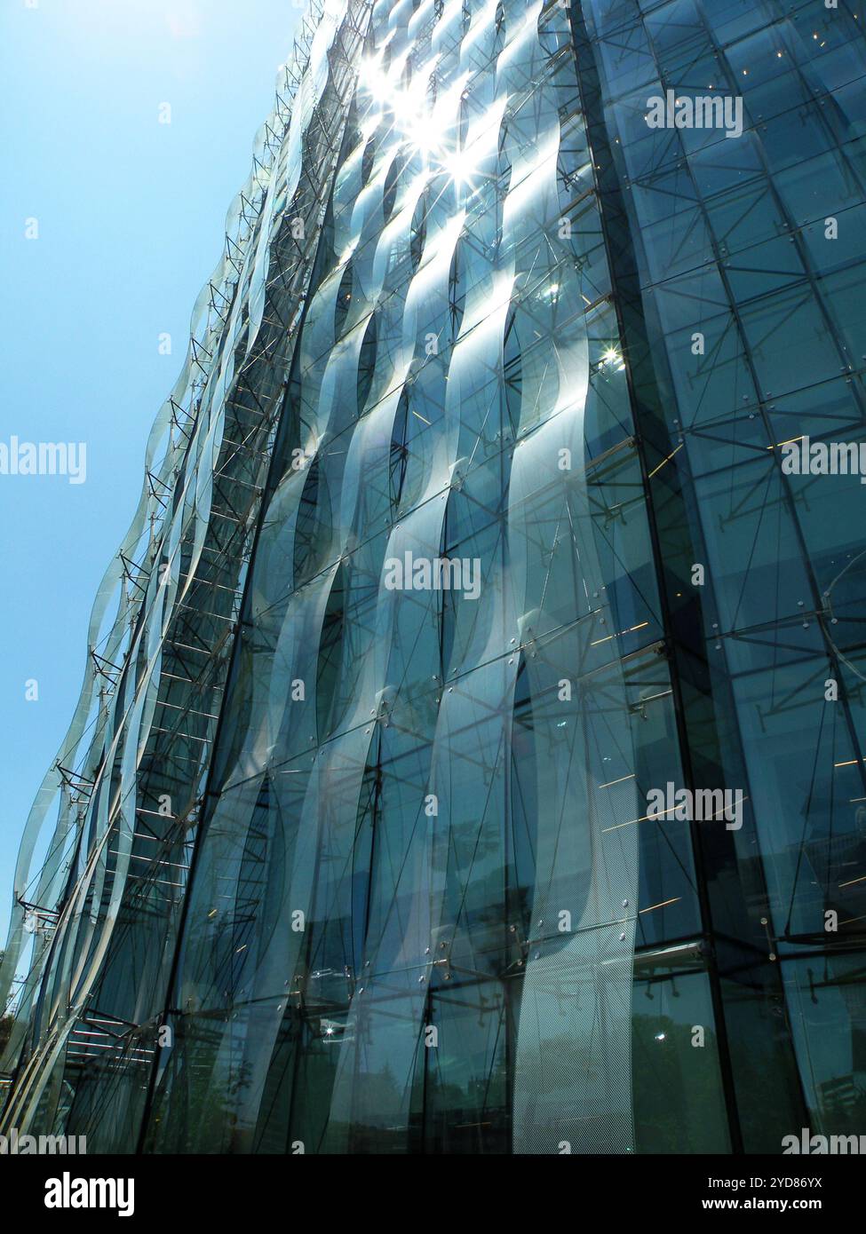 Modern structure with wavy glass Stock Photo - Alamy