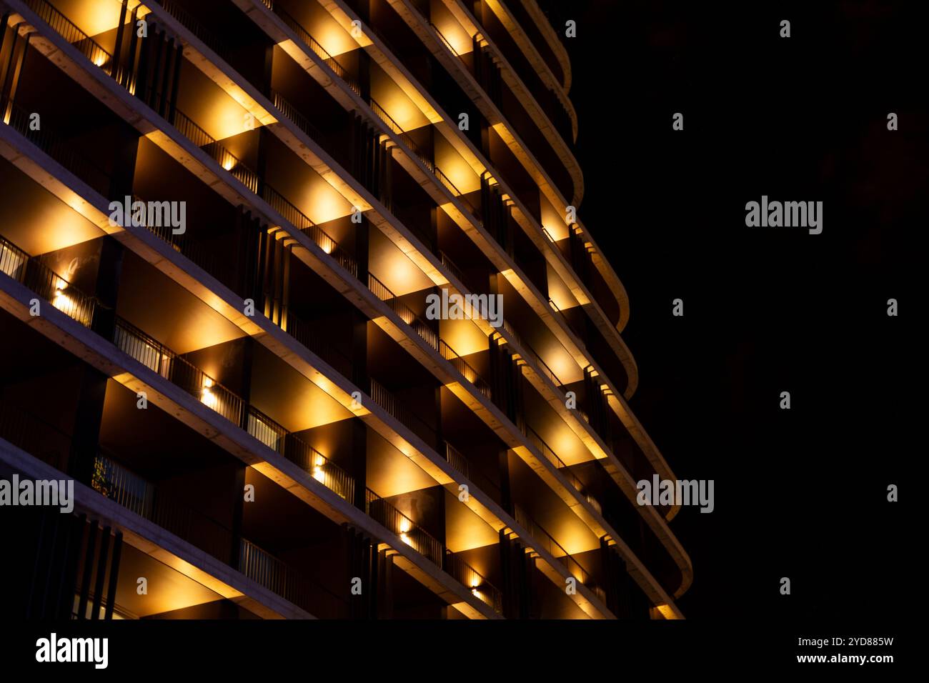 Night view of the facade of a modern building with lights Stock Photo ...