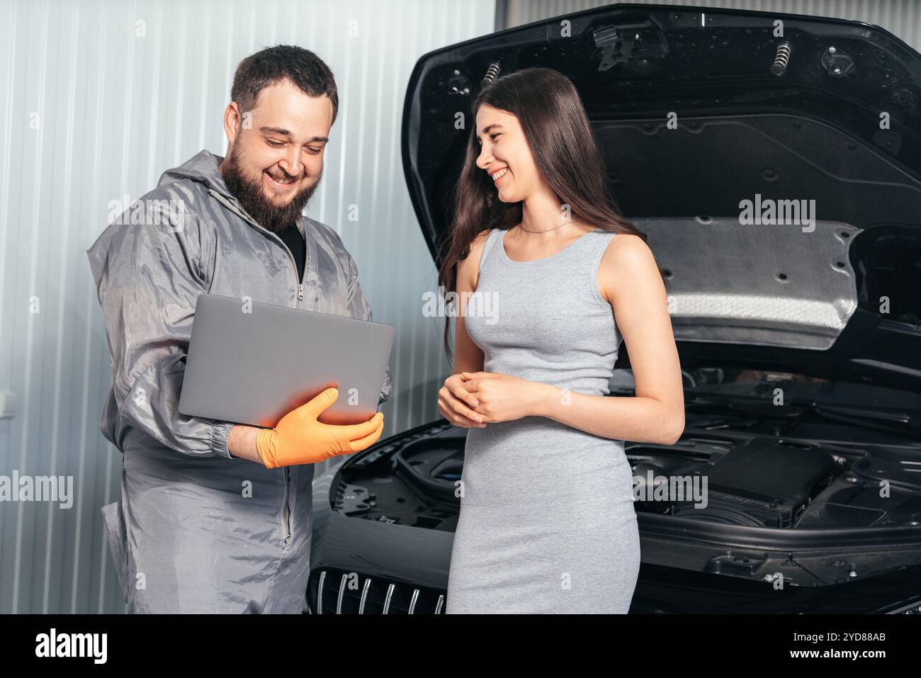 Auto mechanic female customer communicating hi-res stock photography ...