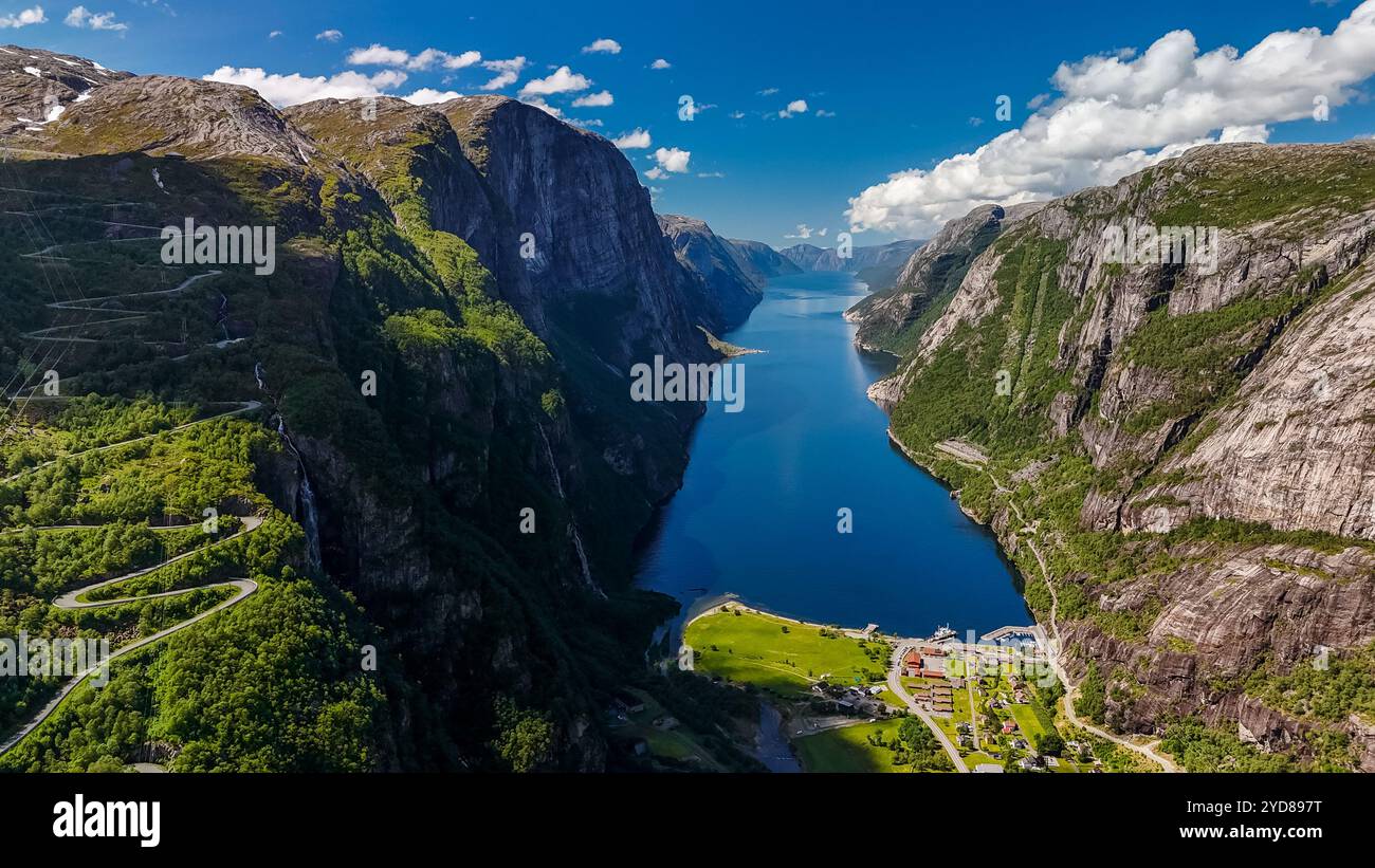 Lysebotn, Lysefjorden, Norway A winding road cuts through lush green ...