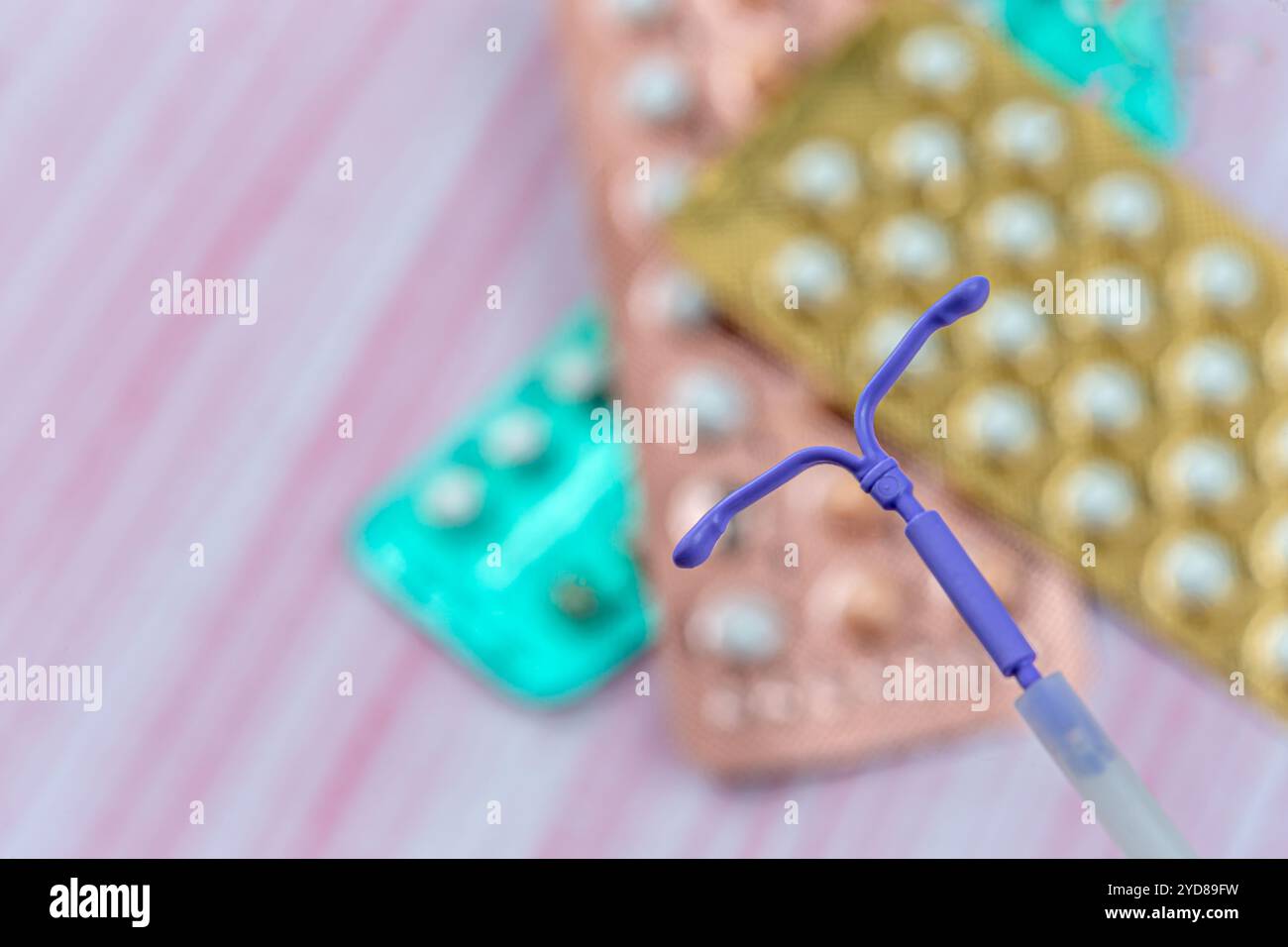 Contraception methods: pill and IUD Stock Photo - Alamy