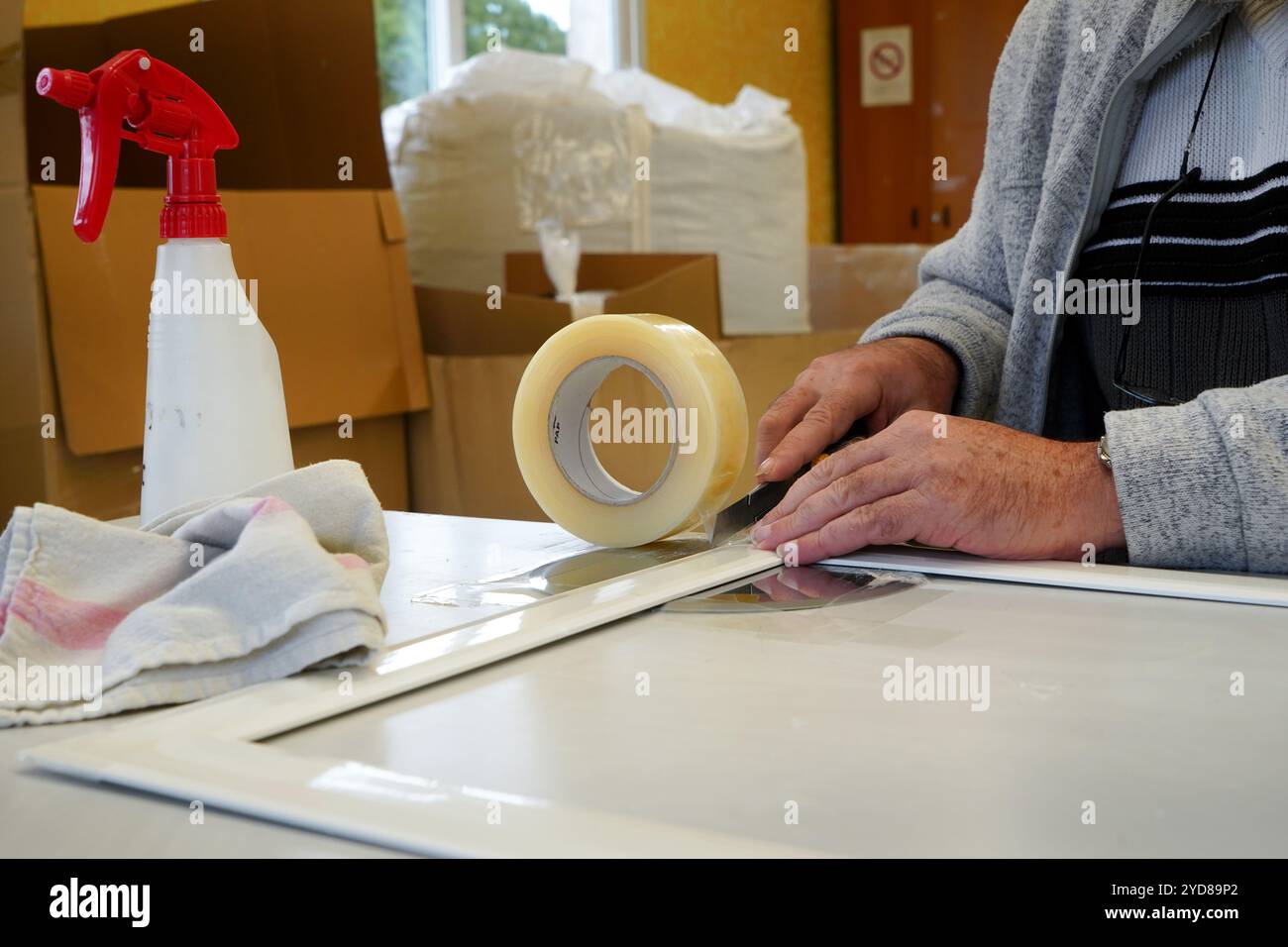 Disabled worker working in the shaping and packaging workshop. Quality ...