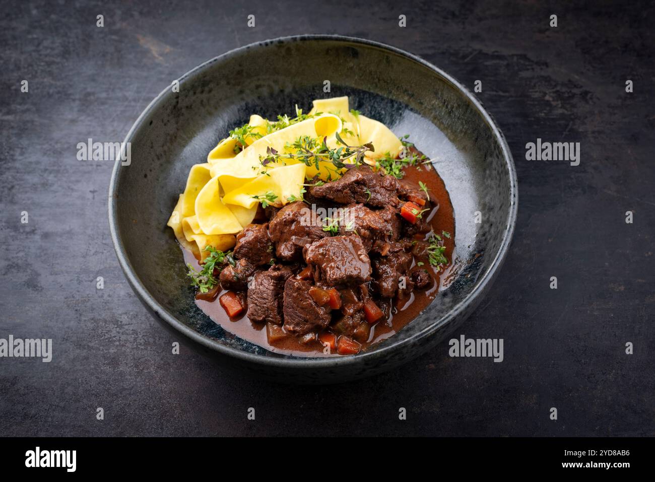 Traditional German braised venison ragout with vegetable and ...