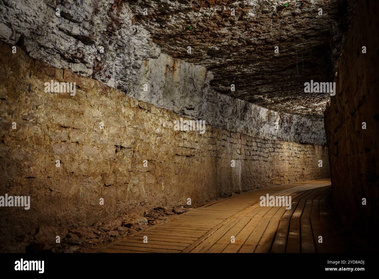 Mysterious Underground Stone Tunnel Featuring Wooden Walkway and ...