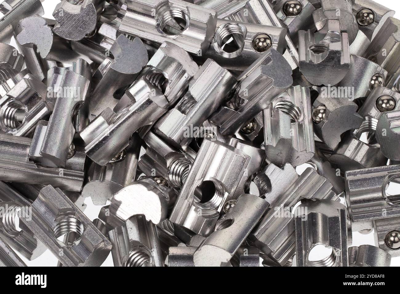 Pile of metal threaded nuts with ball bearings Stock Photo - Alamy