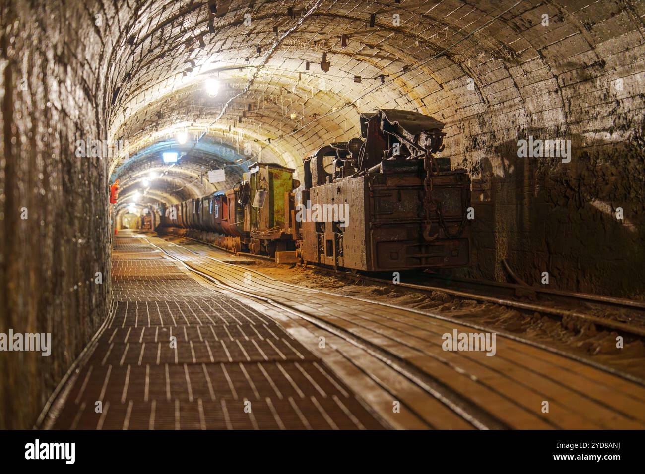 A Rusty Old Mining Train Stands Alone In A Dark, Creepy Mine Tunnel ...