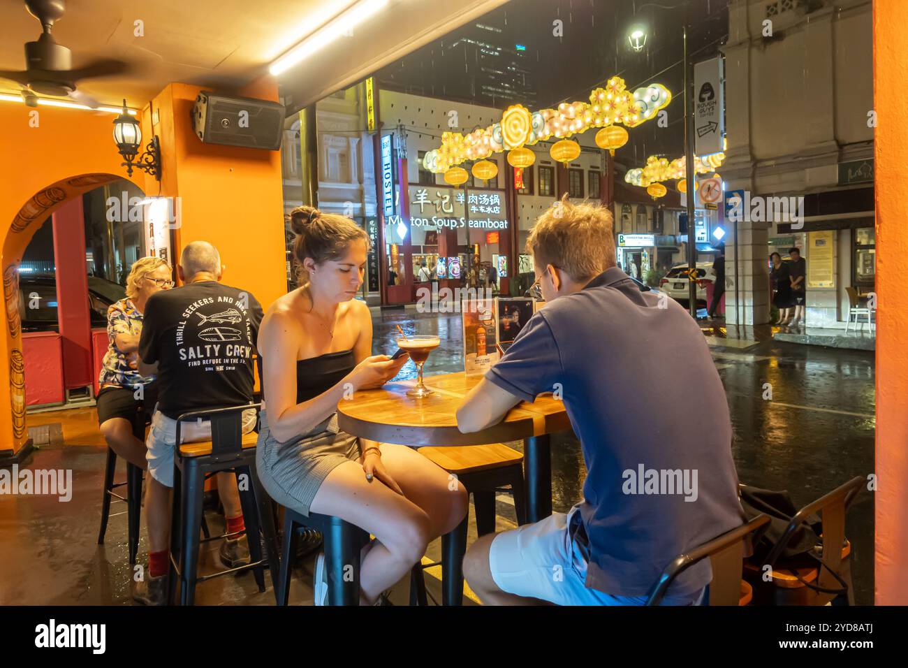 Singapore Chinatown, bar with outdoor sits on Mosque street, caucasian ...