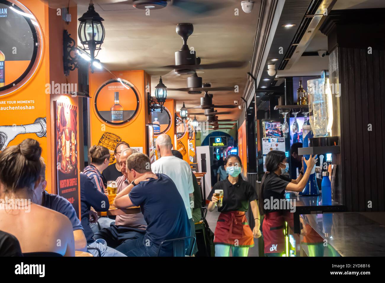 Bartender bringing beer to patron hi-res stock photography and images ...