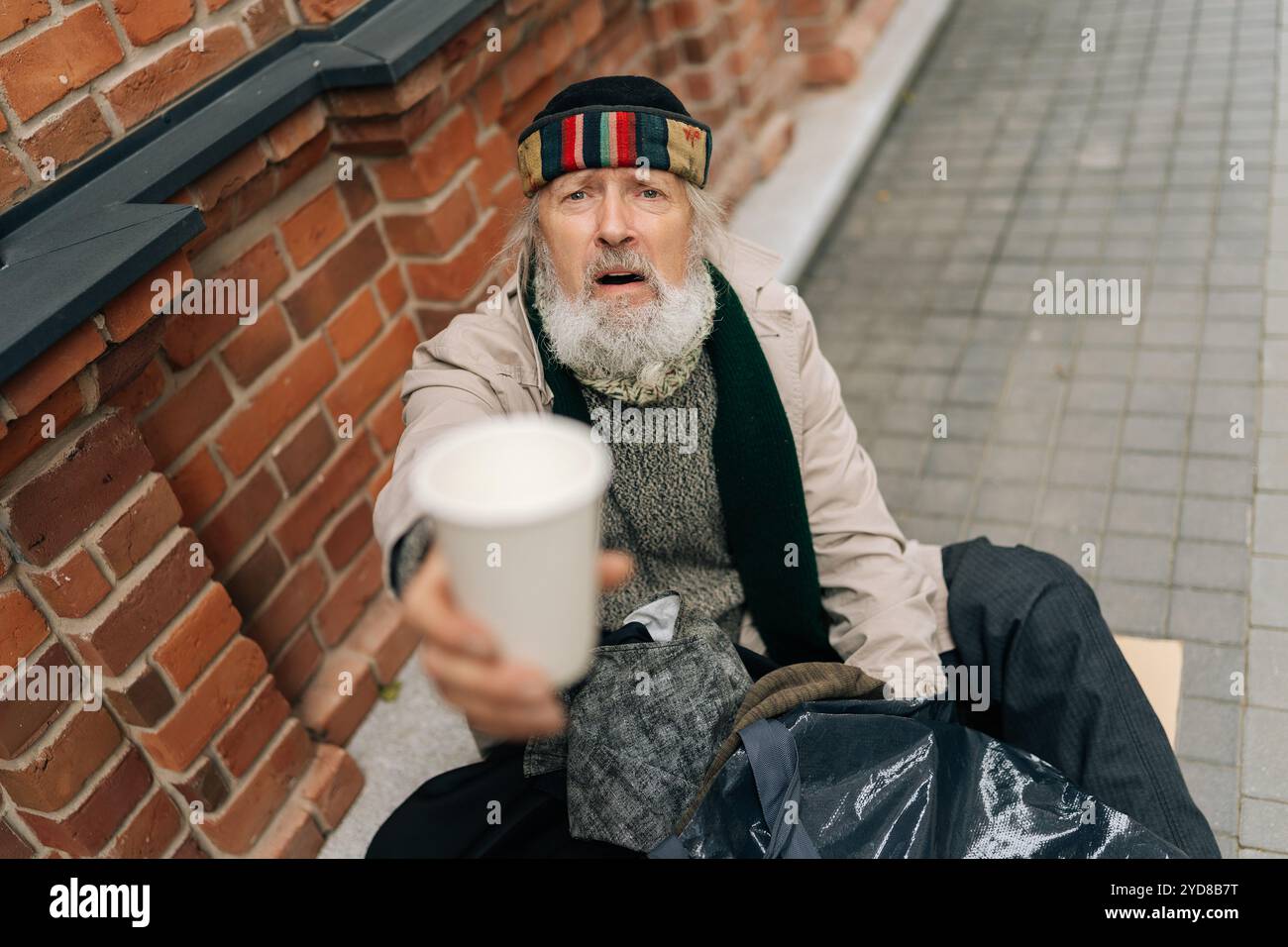 Homeless man wearing worn clothes hi-res stock photography and images ...