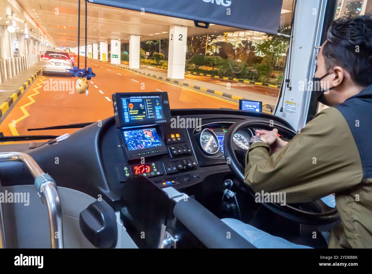 Bus driver cabin of the Singapore airport shuttle bus traveling between ...