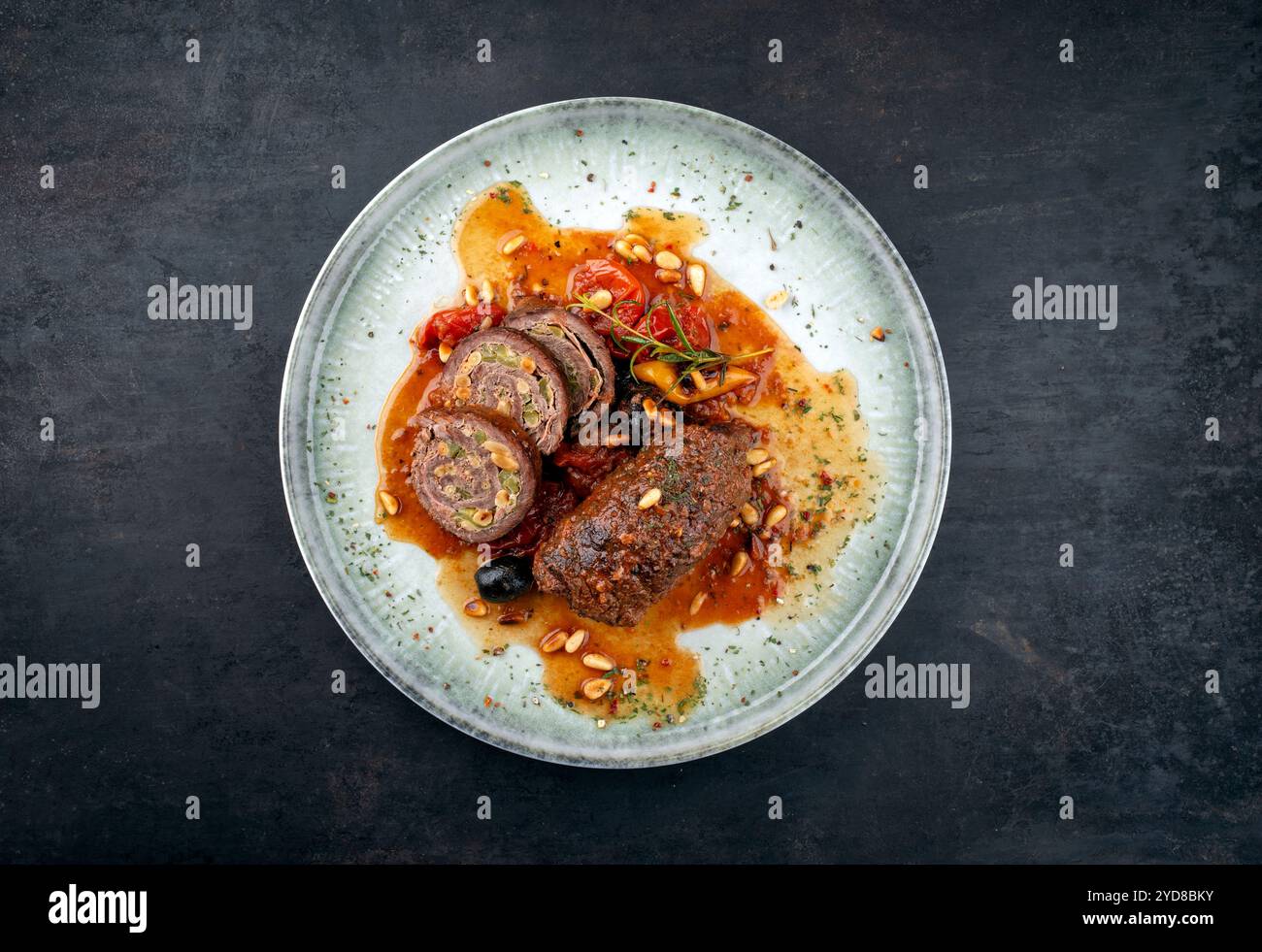 Traditional slow cooked German wagyu beef roulades with olives and pine ...