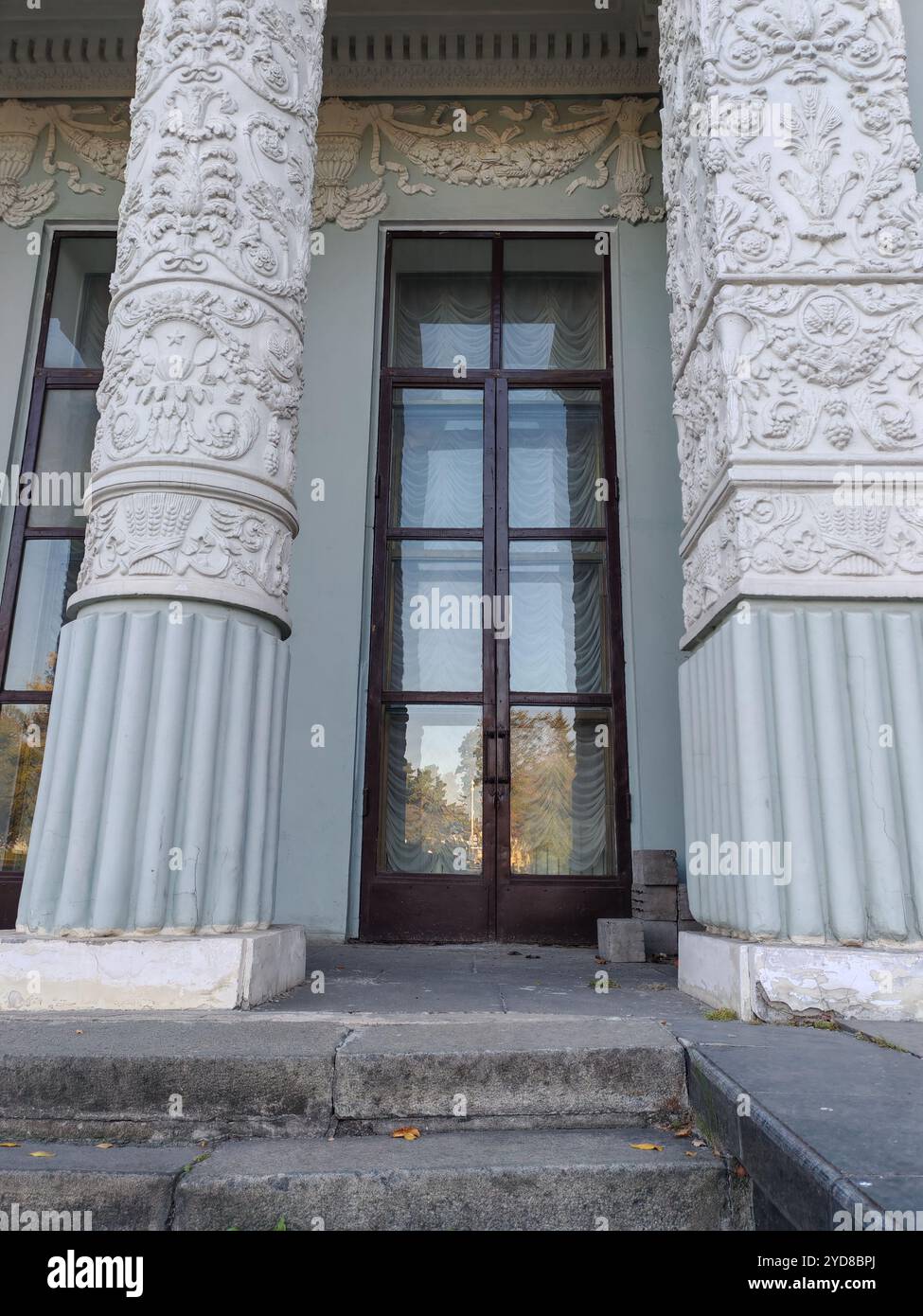 A detailed view of a building featuring intricate decorative motifs and ...